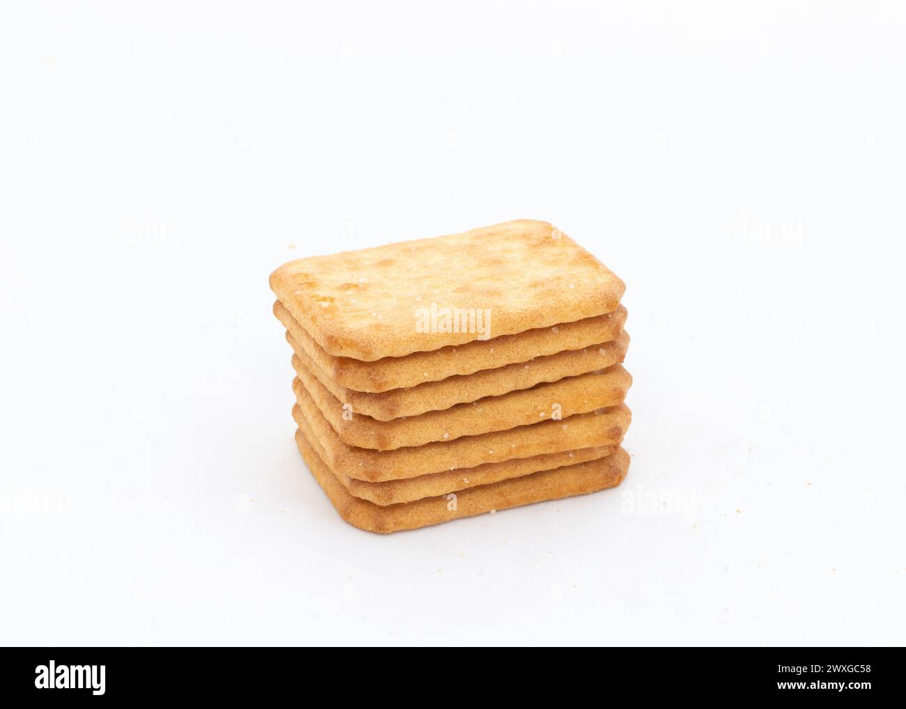 Closeup of a stack of salty crackers biscuits isolated on white ...