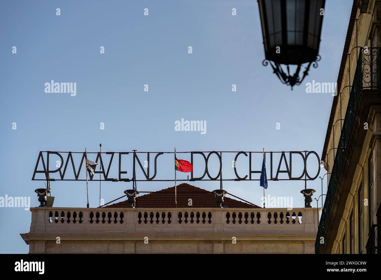 Sign and flags on top of Armazéns do Chiado shopping center in Lisbon ...