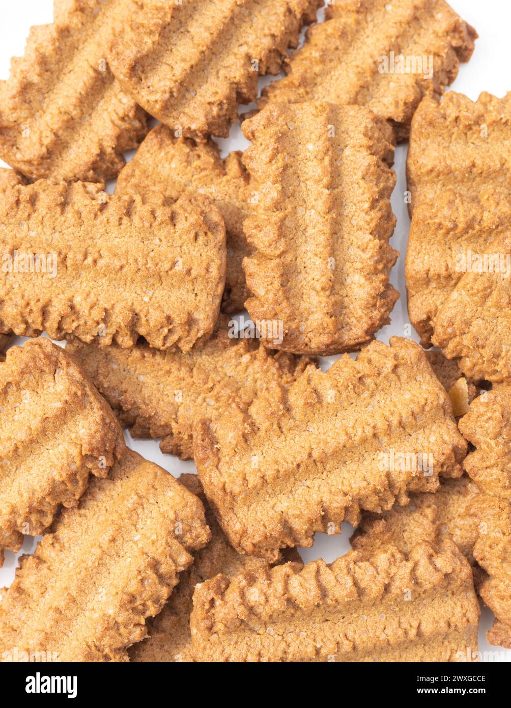 Brown crunchy biscuits food background Stock Photo - Alamy