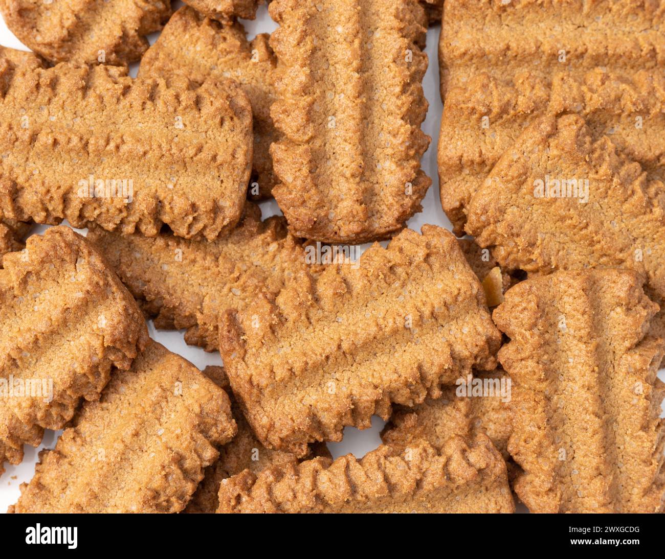 Dark brown sugar sweet tea biscuits background Stock Photo - Alamy