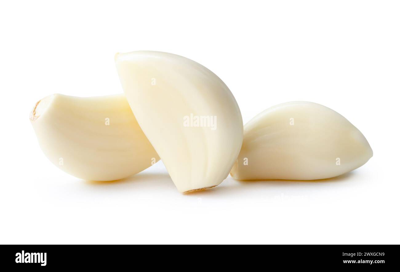 Front view of garlic cloves or slices in stack is isolated on white ...