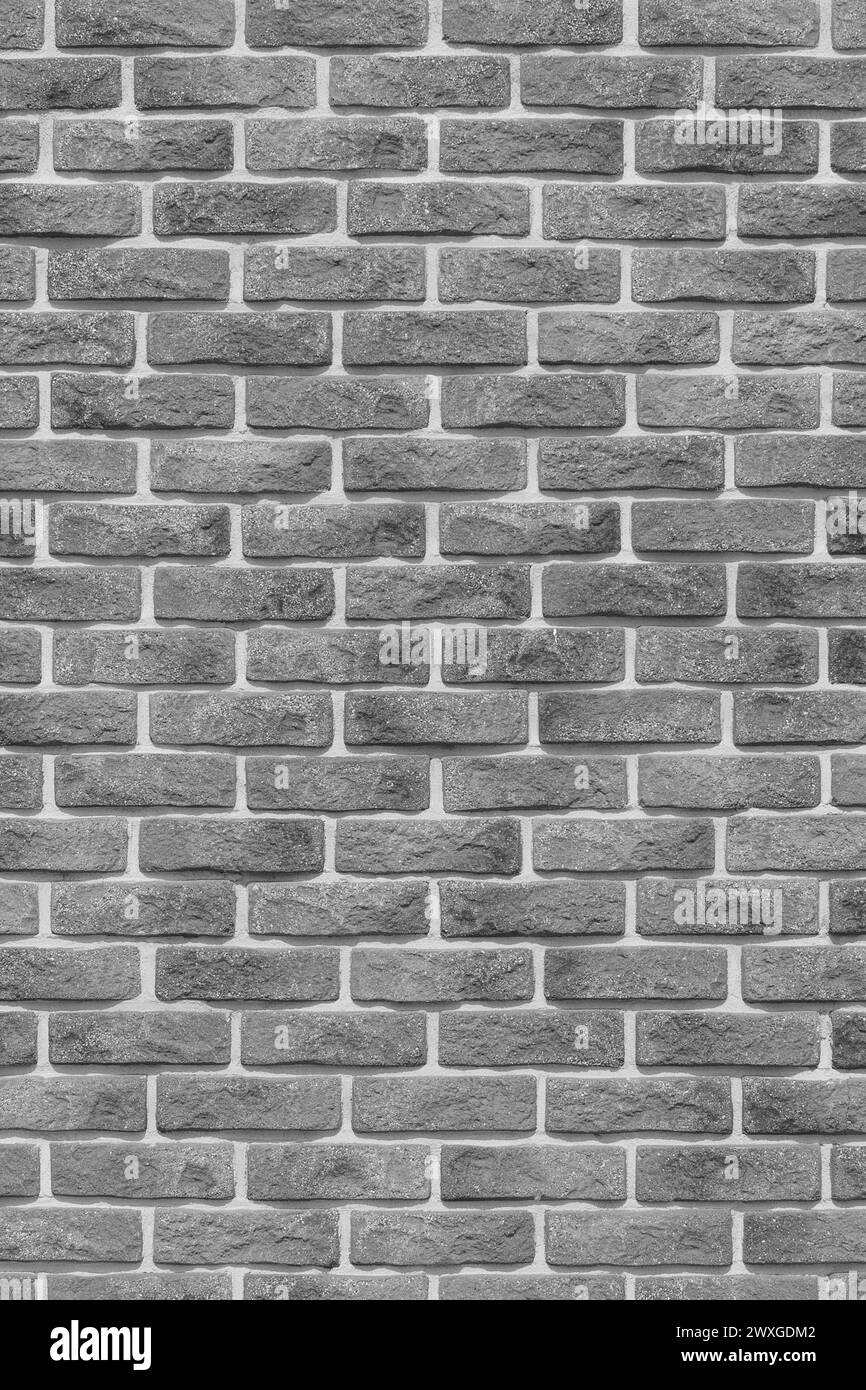 Vertical grey brickwork masonry brick wall texture background facade ...