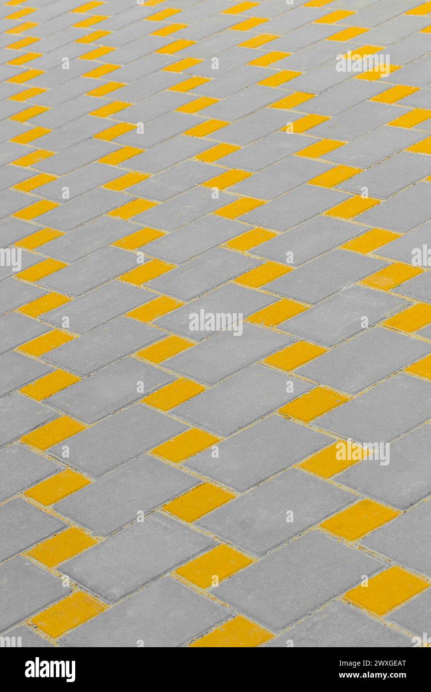 Yellow and grey paving slabs floor abstract pattern city street surface ...