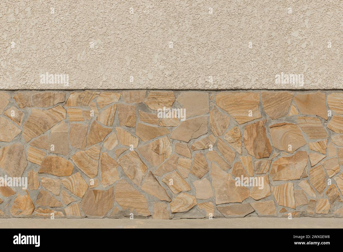 Facade building exterior house with light plaster wall and stone brown ...