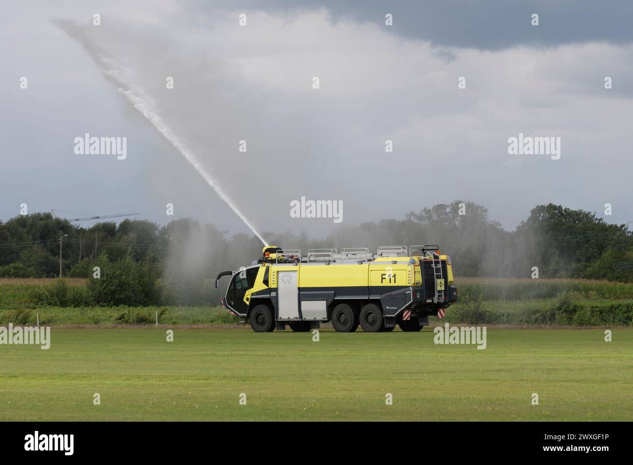 Airfield runway fire truck at work. New Rosenbauer PANTHER crashtender ...