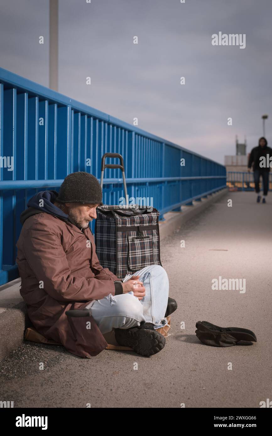 Senior citizen beggar on city overpass begging for some money Stock ...