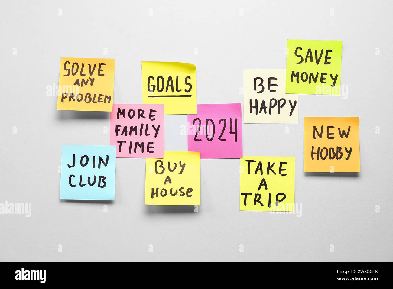Sticky notes with different goals for 2024 on grey background Stock ...