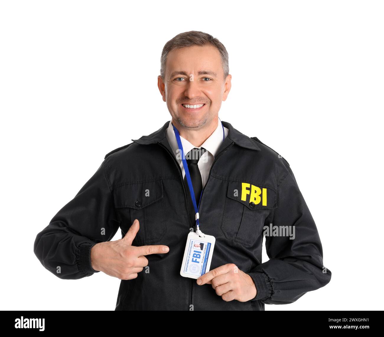 Mature FBI agent pointing at document on white background Stock Photo - Alamy