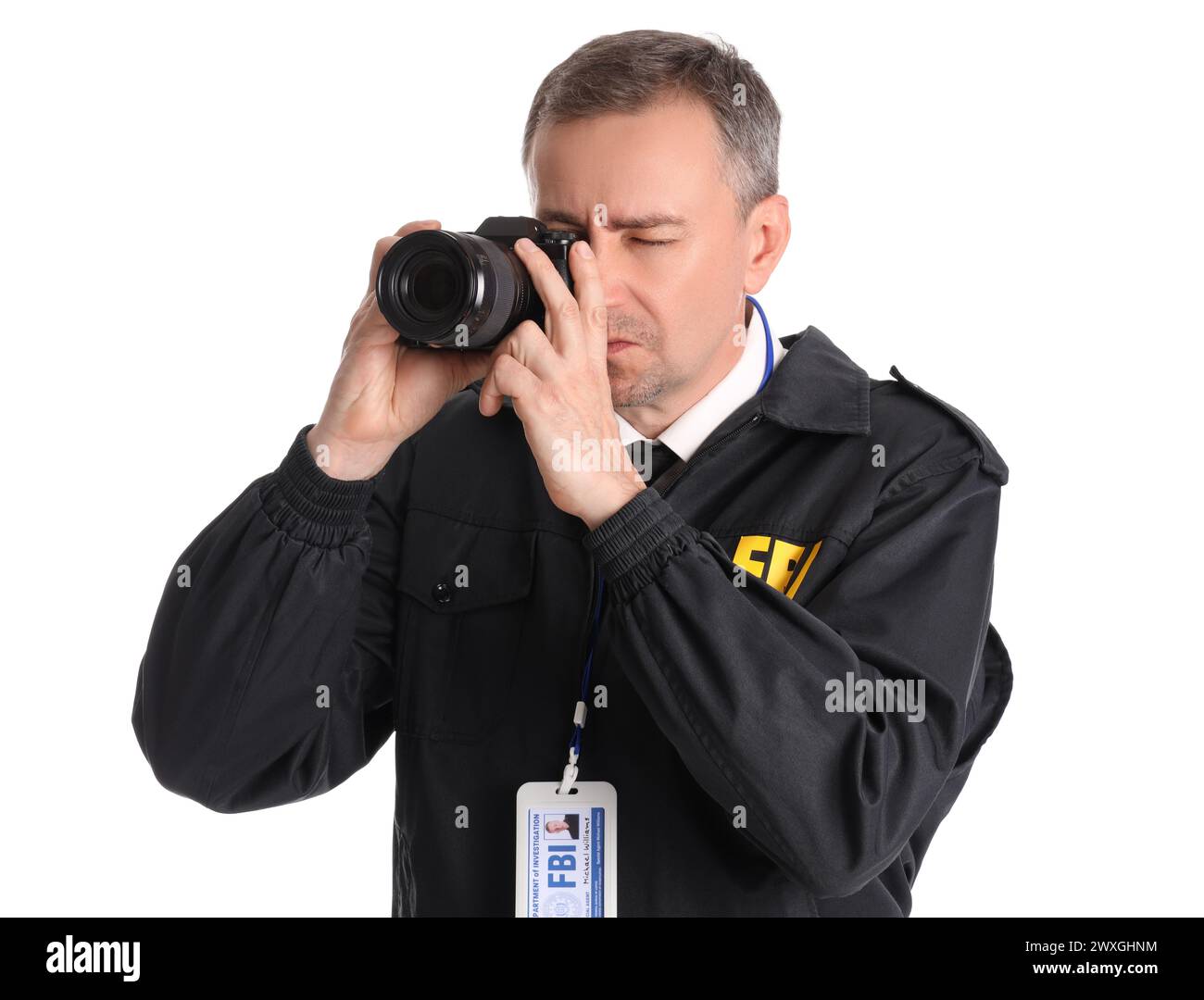 Mature FBI agent with photo camera on white background Stock Photo - Alamy