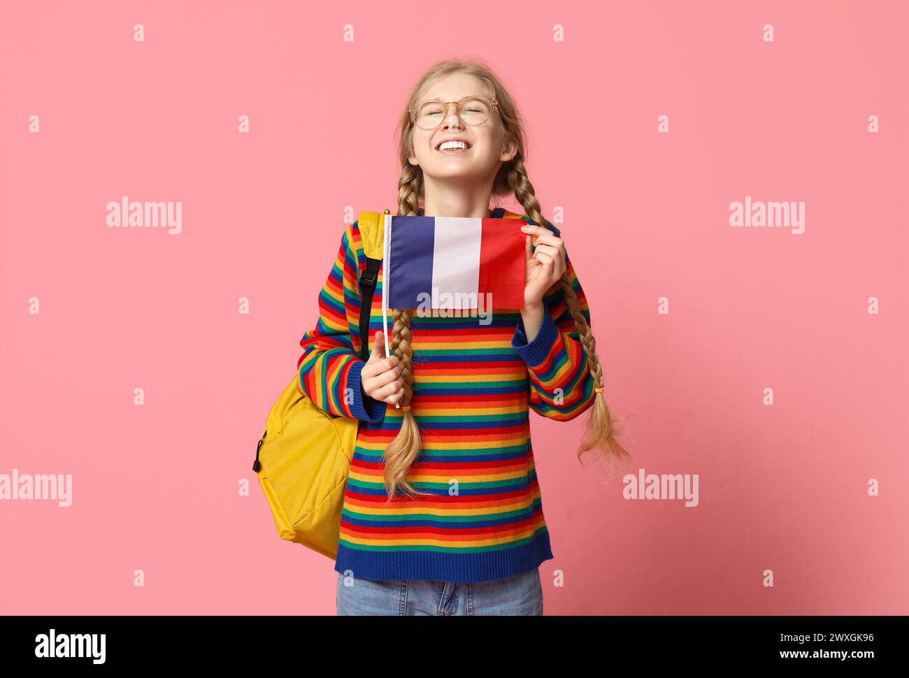 Female student with French flag on pink background Stock Photo - Alamy