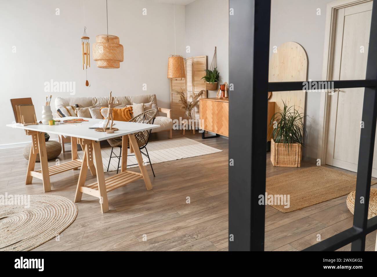 Interior of light room with wind chime and artist's workplace Stock ...