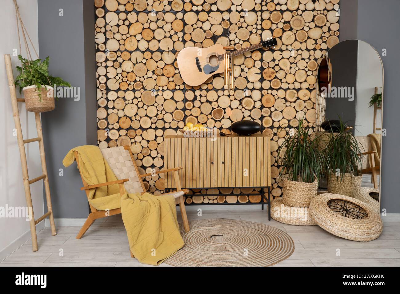 Interior of living room with wind chime, guitar and glucophone on ...