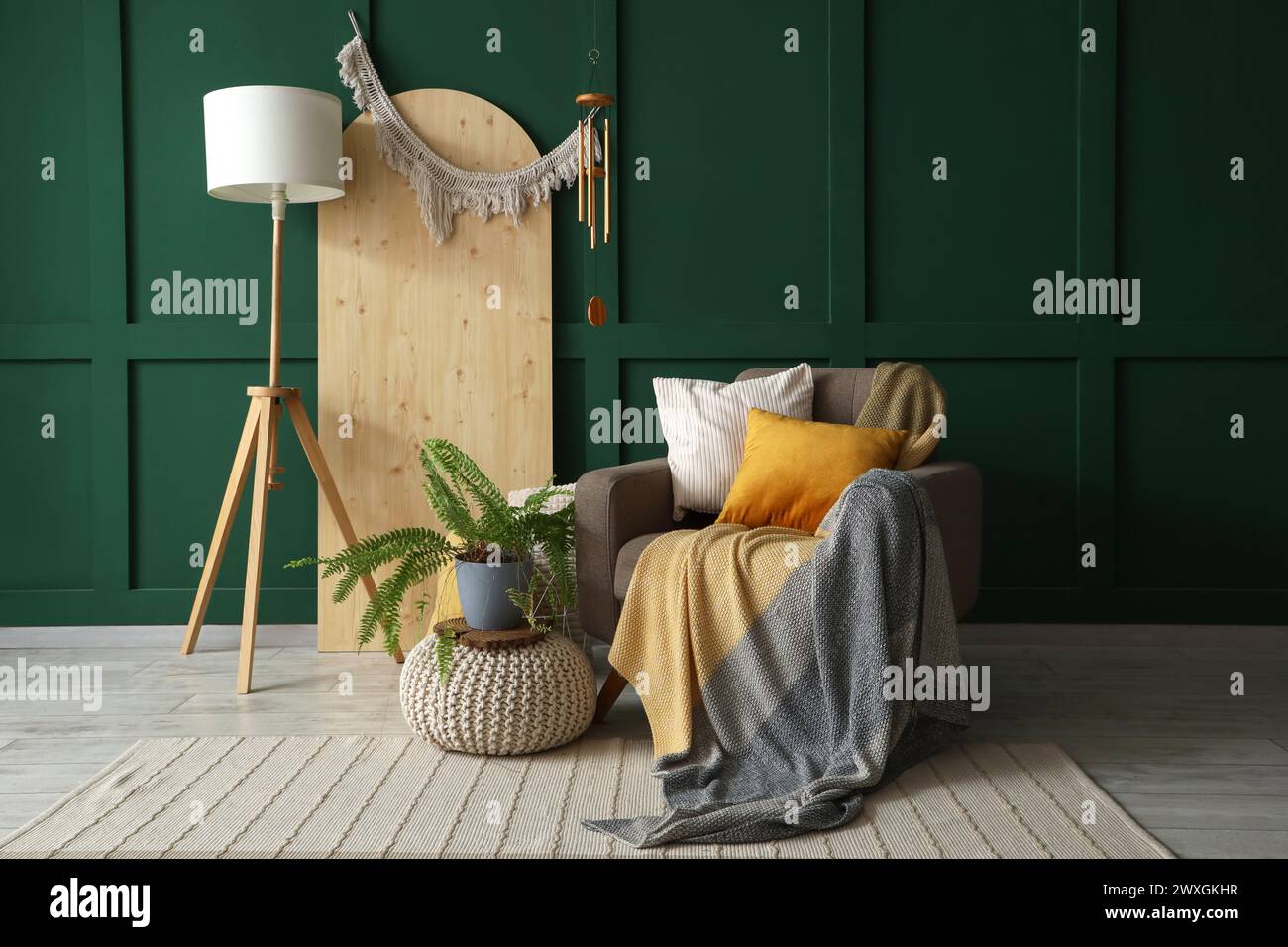Interior of living room with wind chime and armchair Stock Photo - Alamy