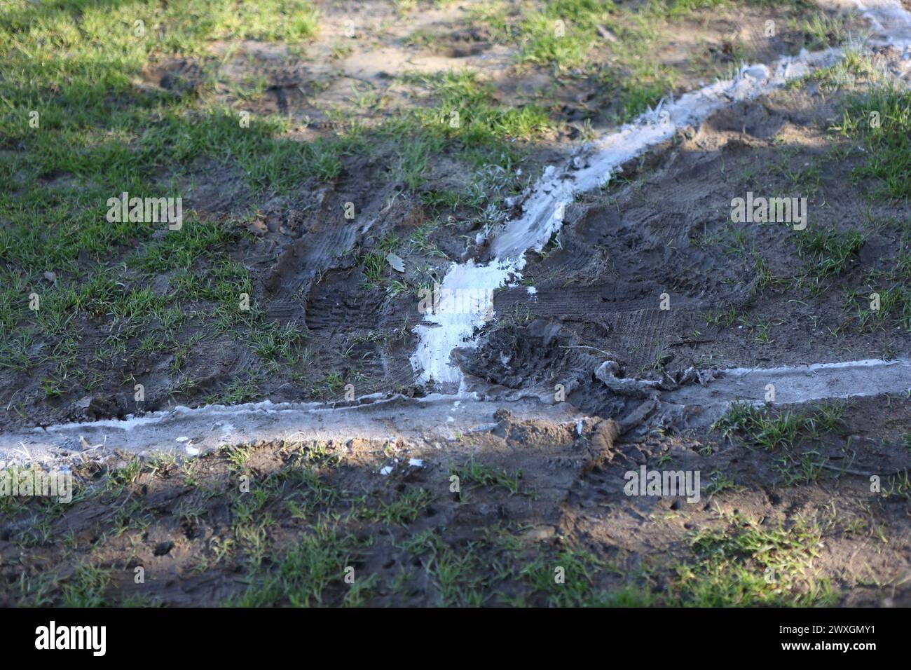 Corner quadrant of football pitch showing pitch markings and mud muddy ...