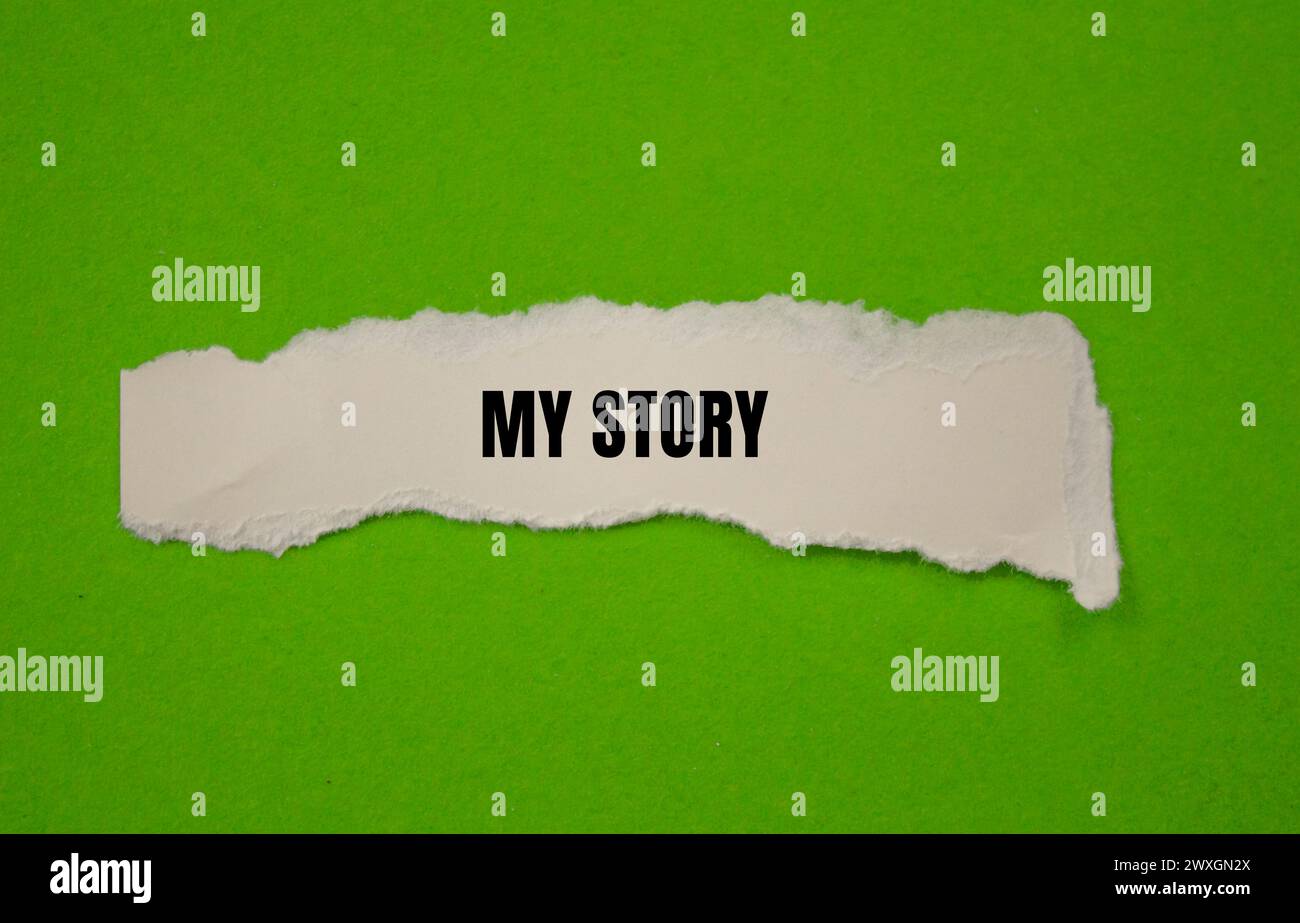 My story words written on torn paper piece with green background ...