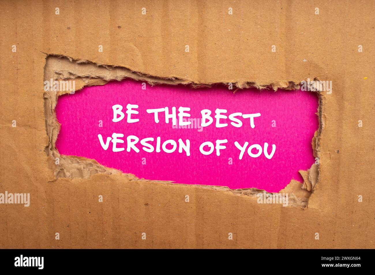 Be the best version of you words written on torn cardboard paper with ...