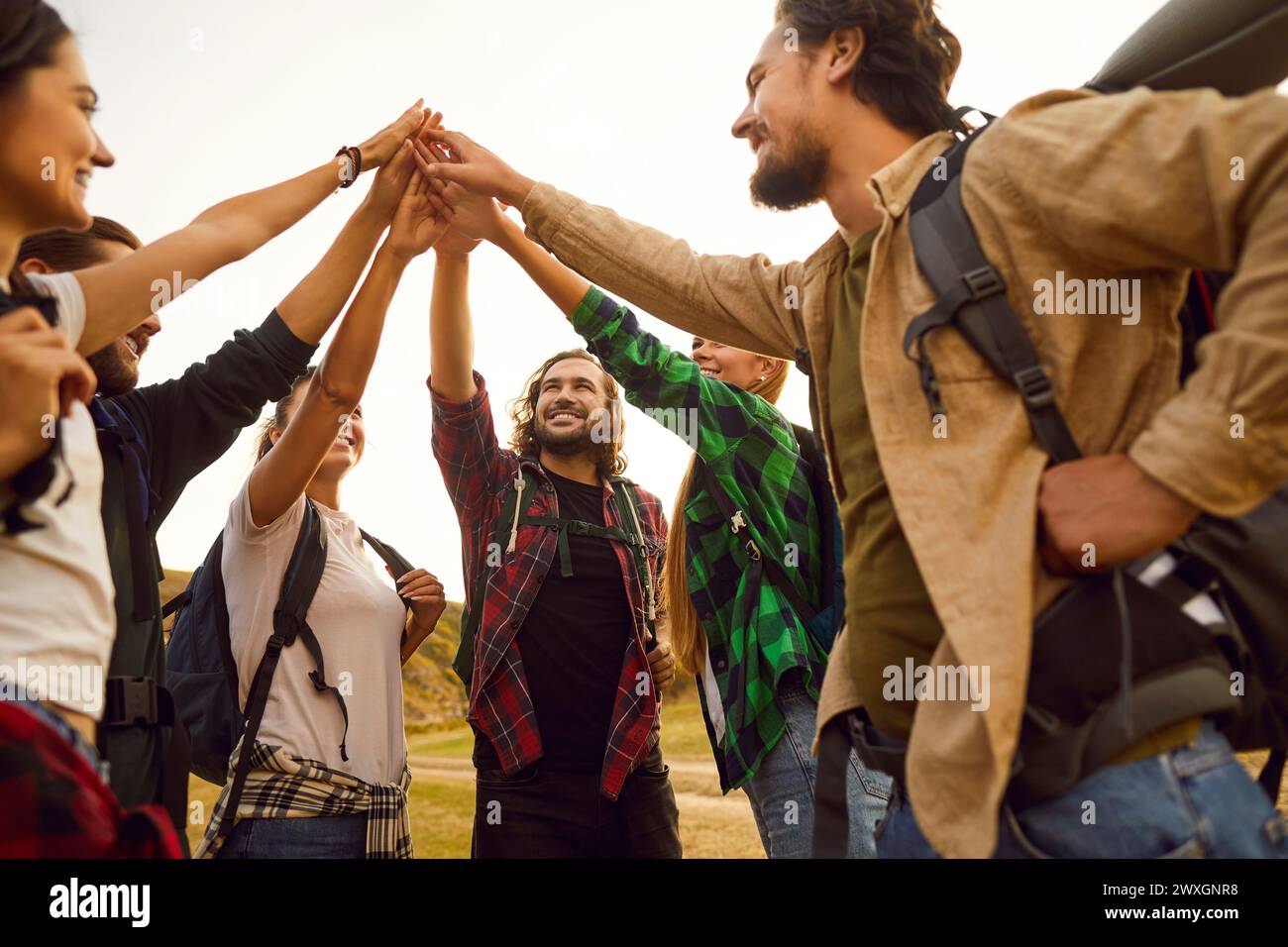 Happy Tourist Team Celebrates Teamwork in Nature Stock Photo - Alamy