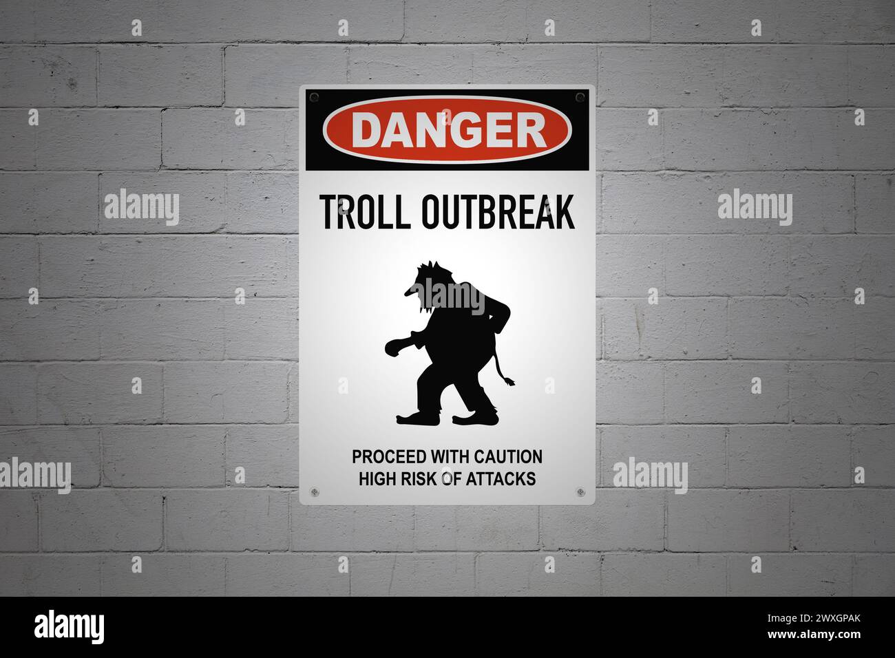 A Danger sign on a white brick wall warning about trolls Stock Photo ...