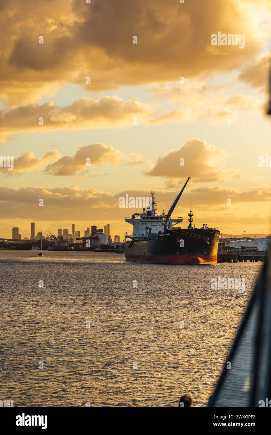 Sunset over Cargo Ship in Australian Port Stock Photo - Alamy