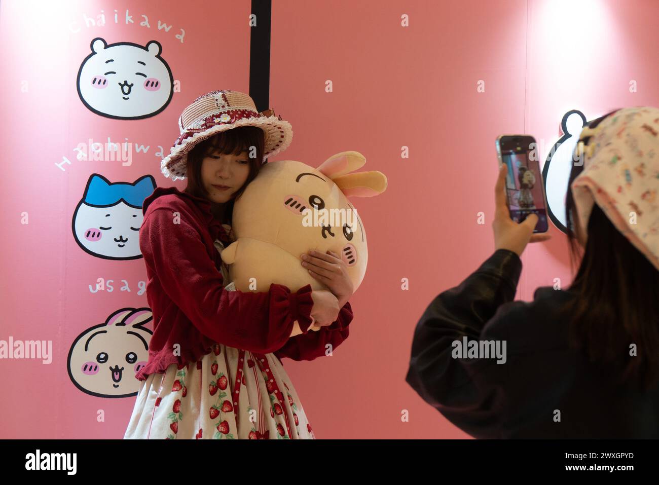 SHANGHAI, CHINA - MARCH 31, 2024 - Young people buy Chiikawa dolls of various sizes and ...