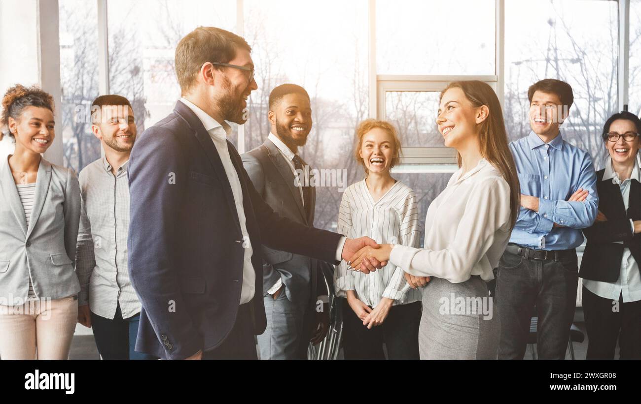 Business handshake between colleagues hi-res stock photography and ...