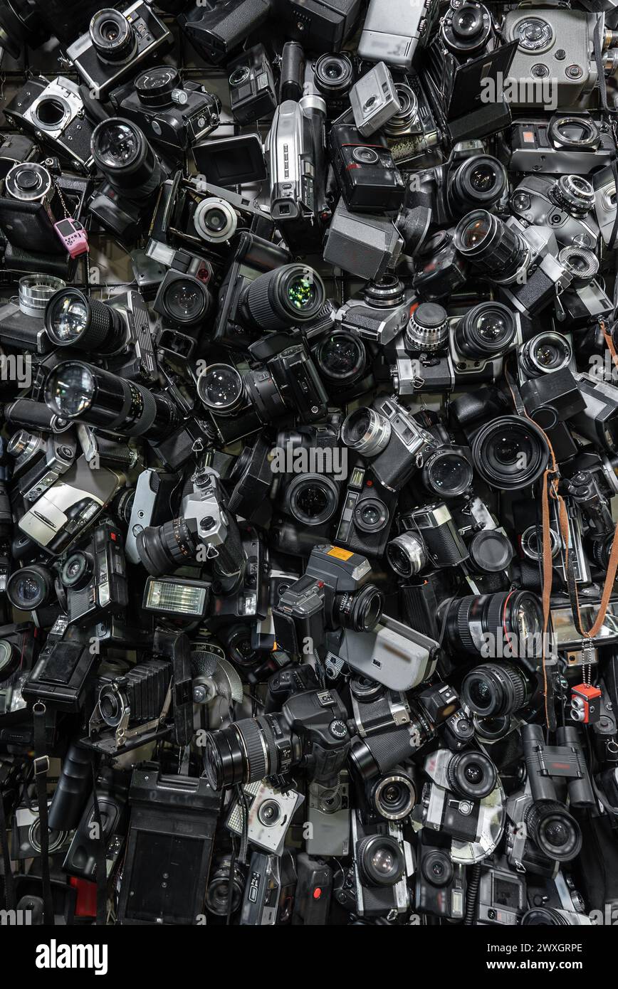 heap of old vintage film cameras and retro lenses, creative abstract ...