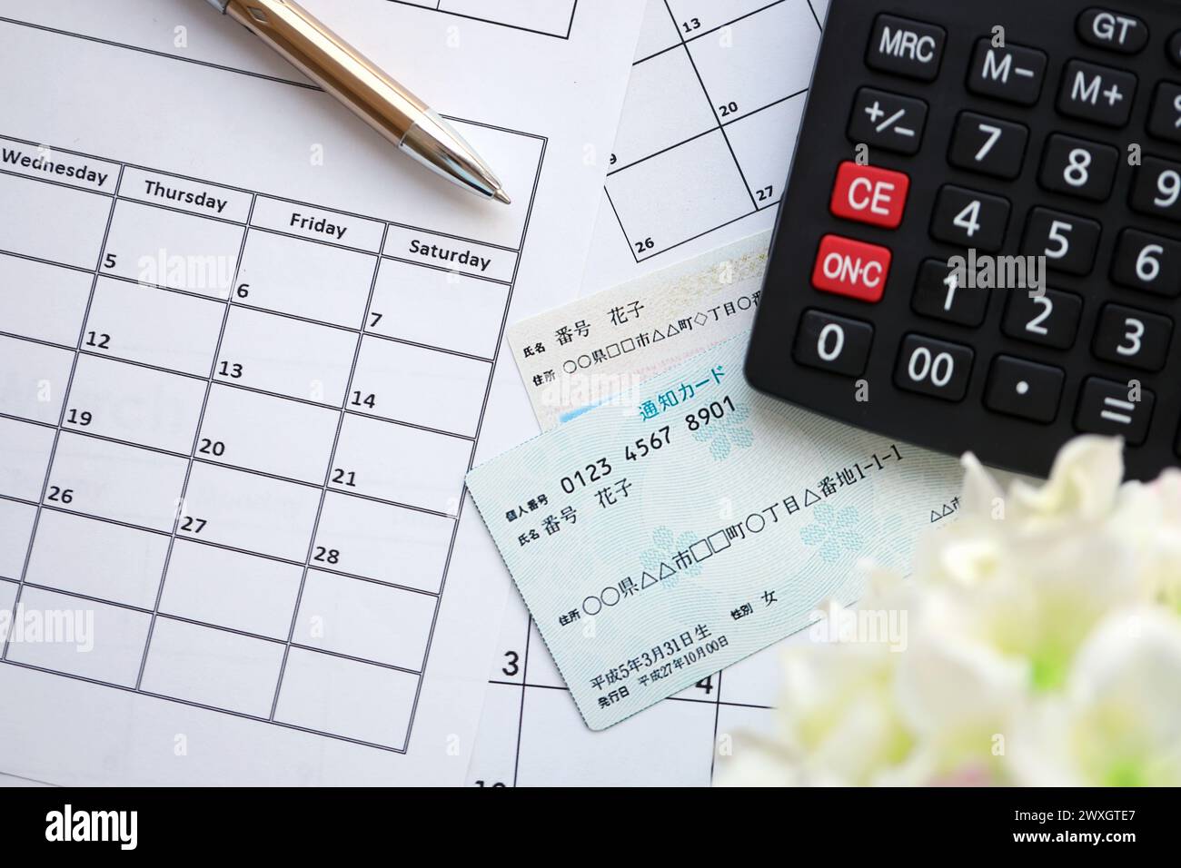 Japanese my number card specimen and notification card on calendar ...
