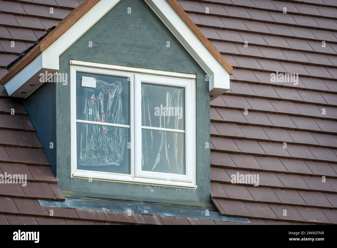 Loft window of new built house in england uk Stock Photo - Alamy