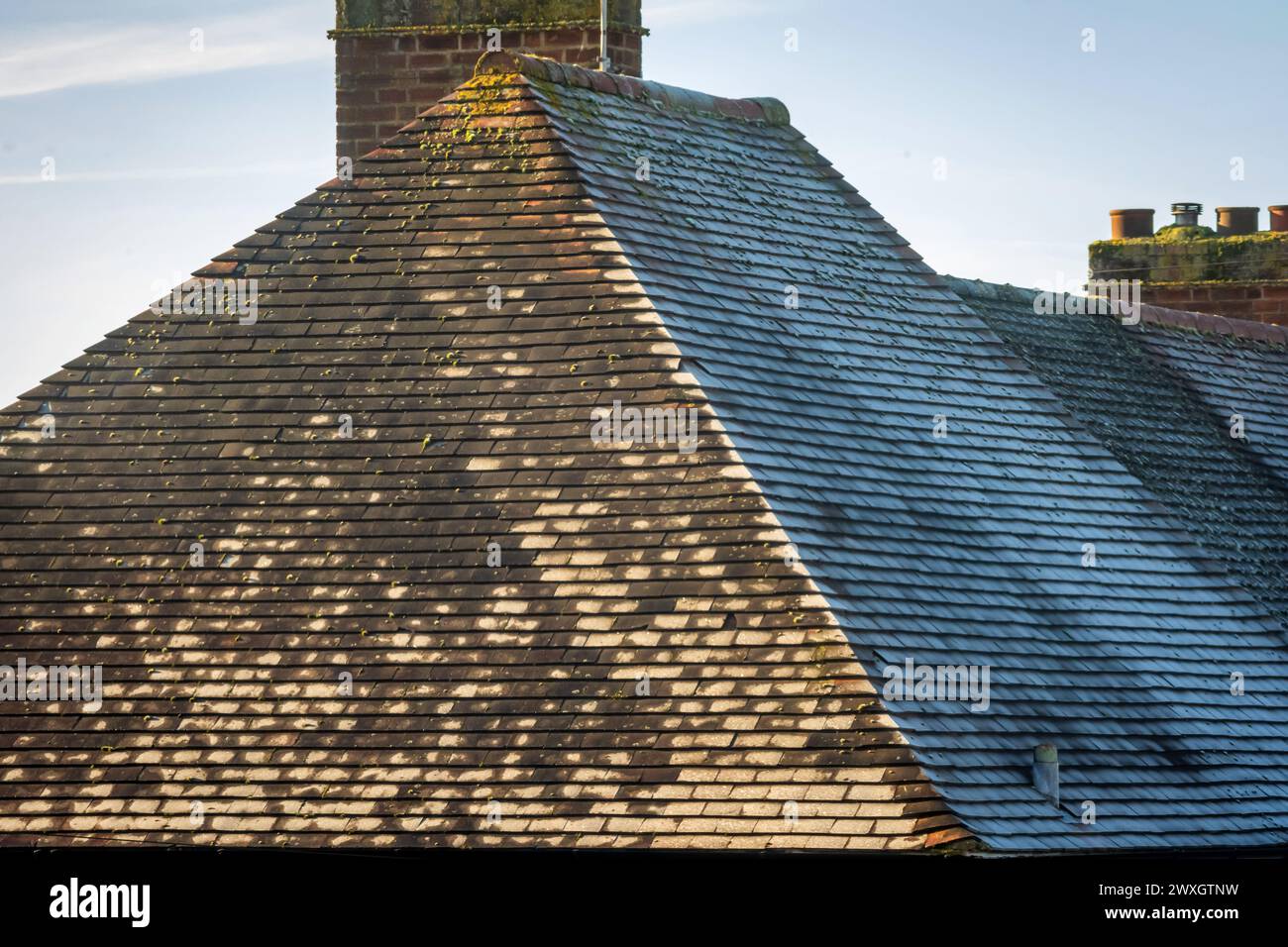 House roof covered with snow frost in england uk Stock Photo - Alamy
