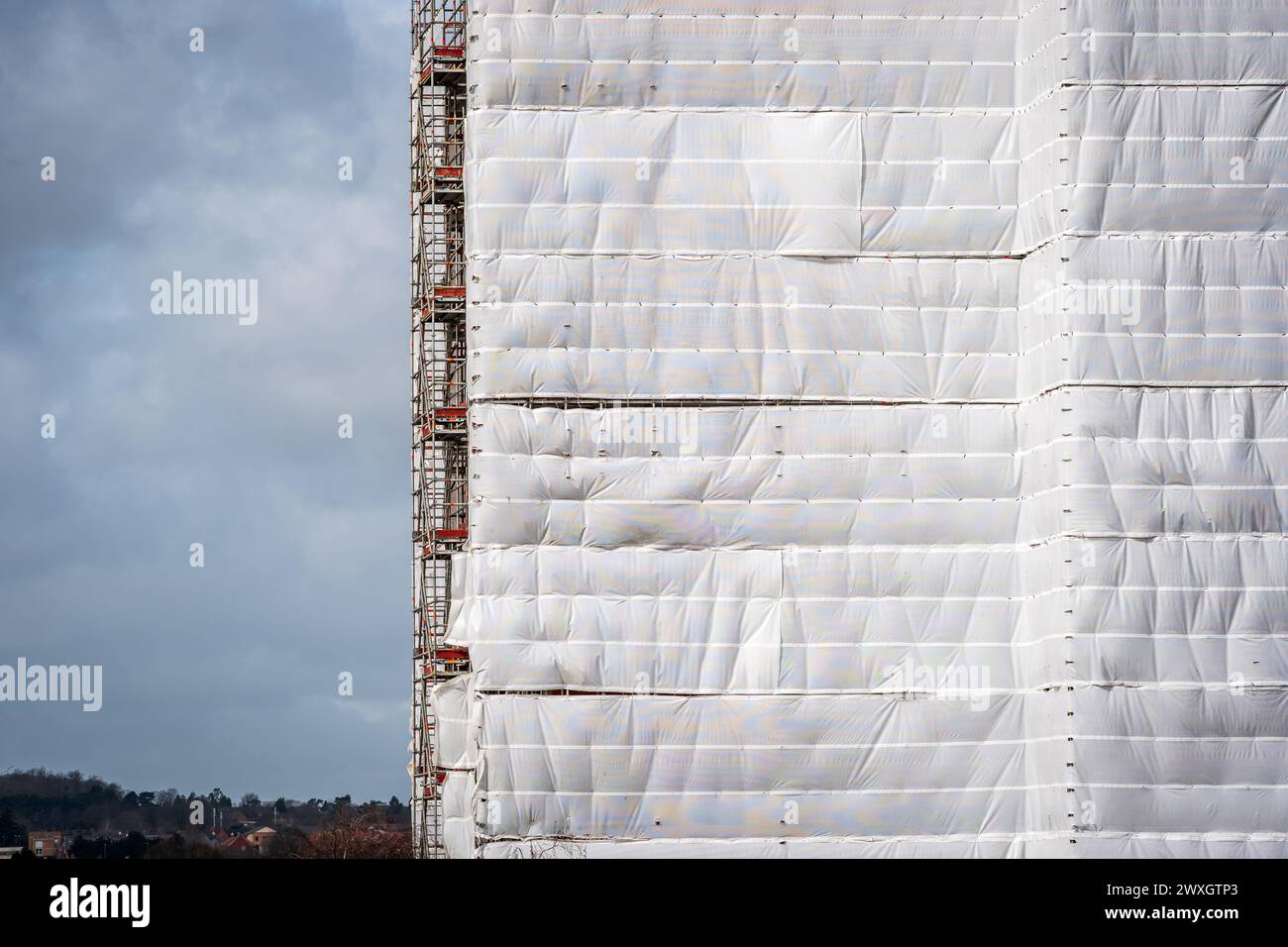Flame retardant scaffold sheeting wrapped apartments building during ...