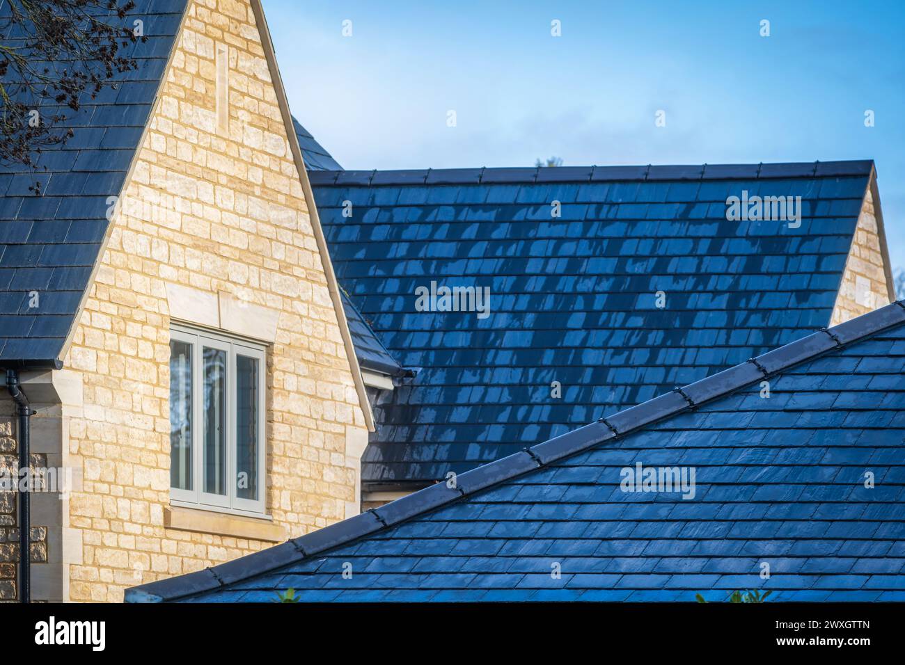 New build cotswold stone brick house in england uk Stock Photo - Alamy