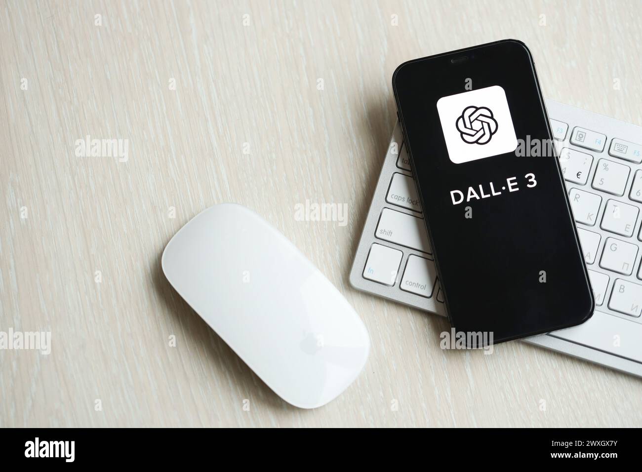 KYIV, UKRAINE - MARCH 17, 2024 Dall-E 3 logo on iPhone display screen with apple keyboard and ...