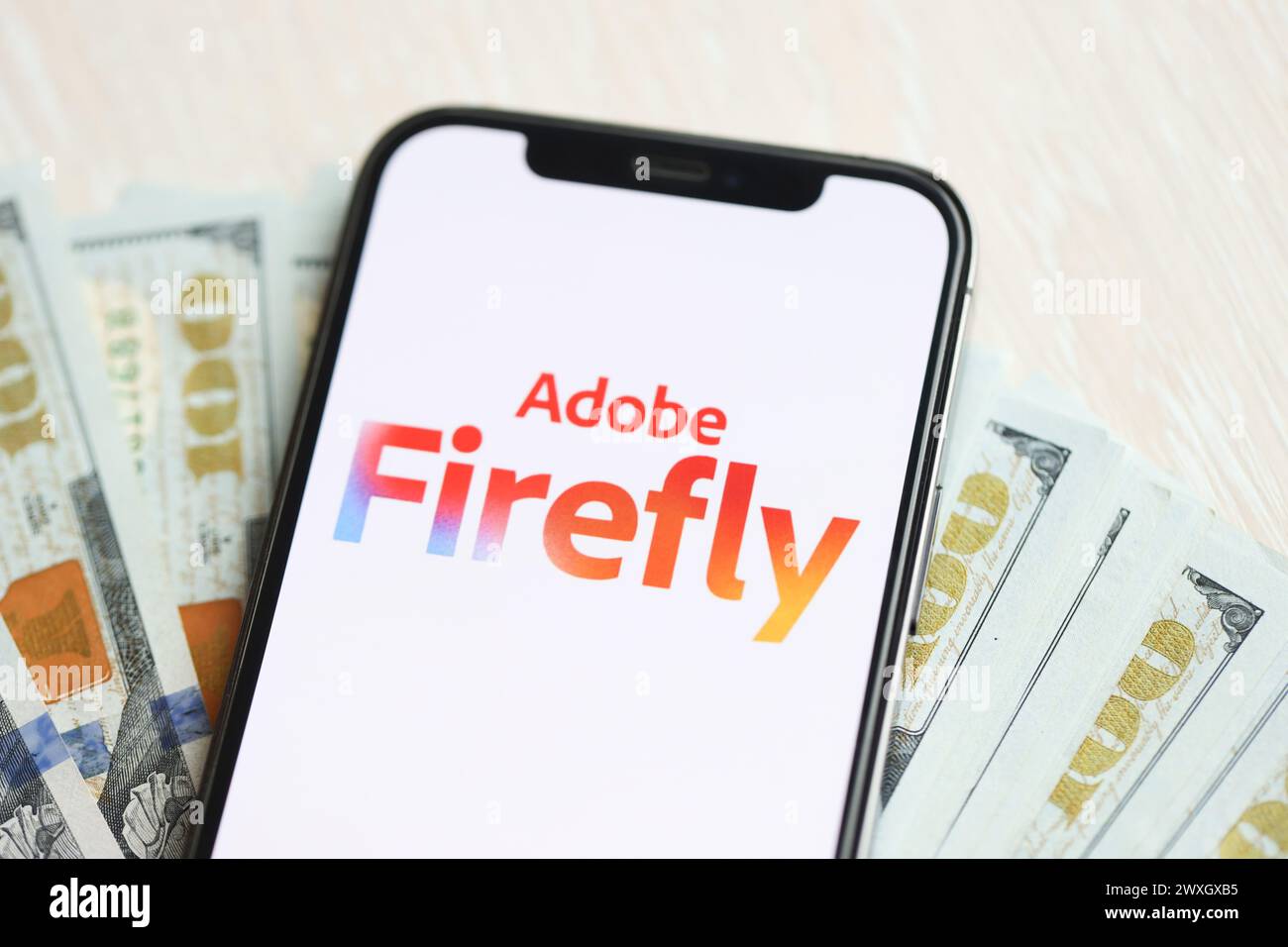 KYIV, UKRAINE - MARCH 17, 2024 Adobe Firefly logo on iPhone display ...