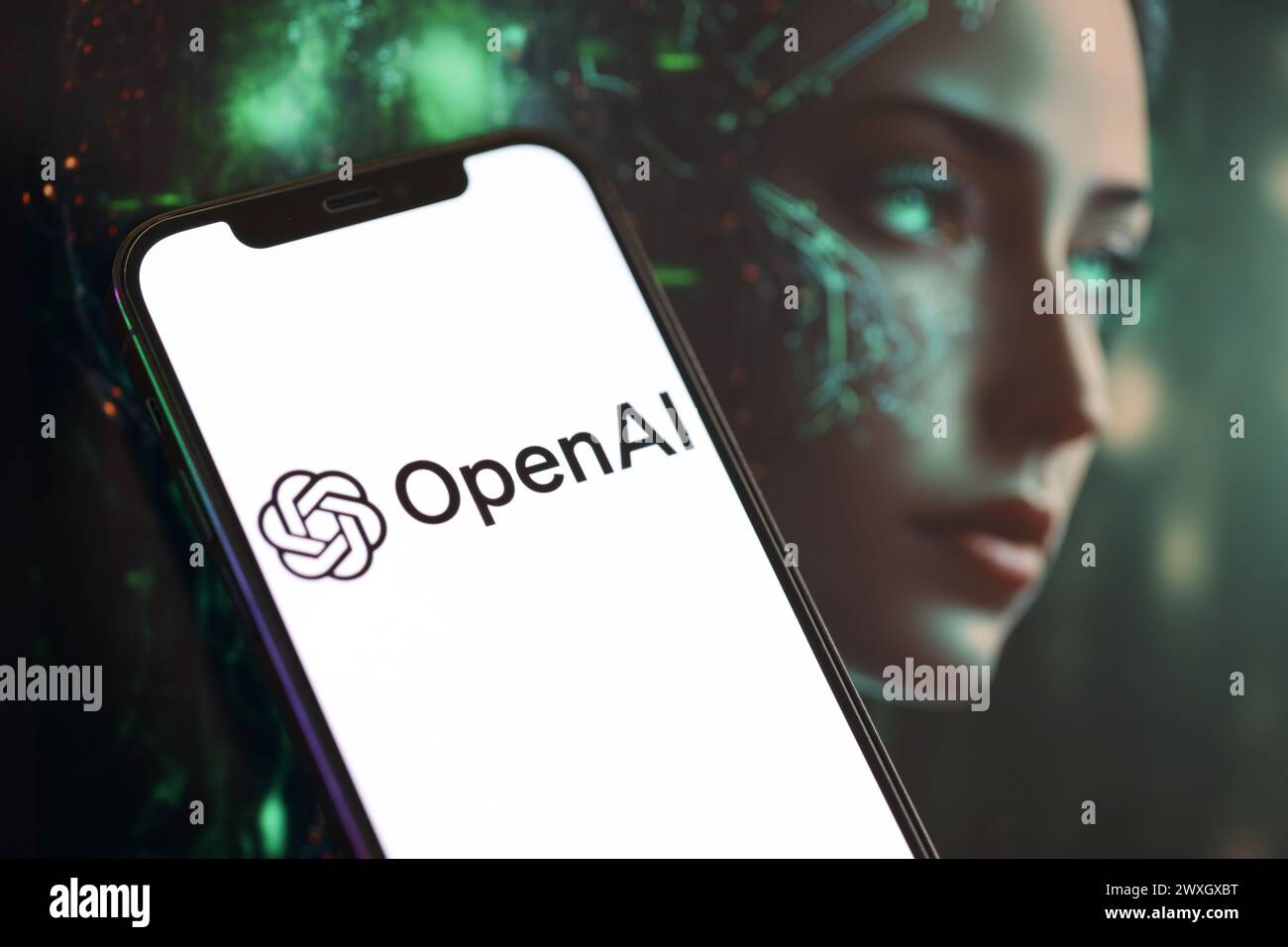 KYIV, UKRAINE - MARCH 17, 2024 OpenAI logo on iPhone display screen with background of ...