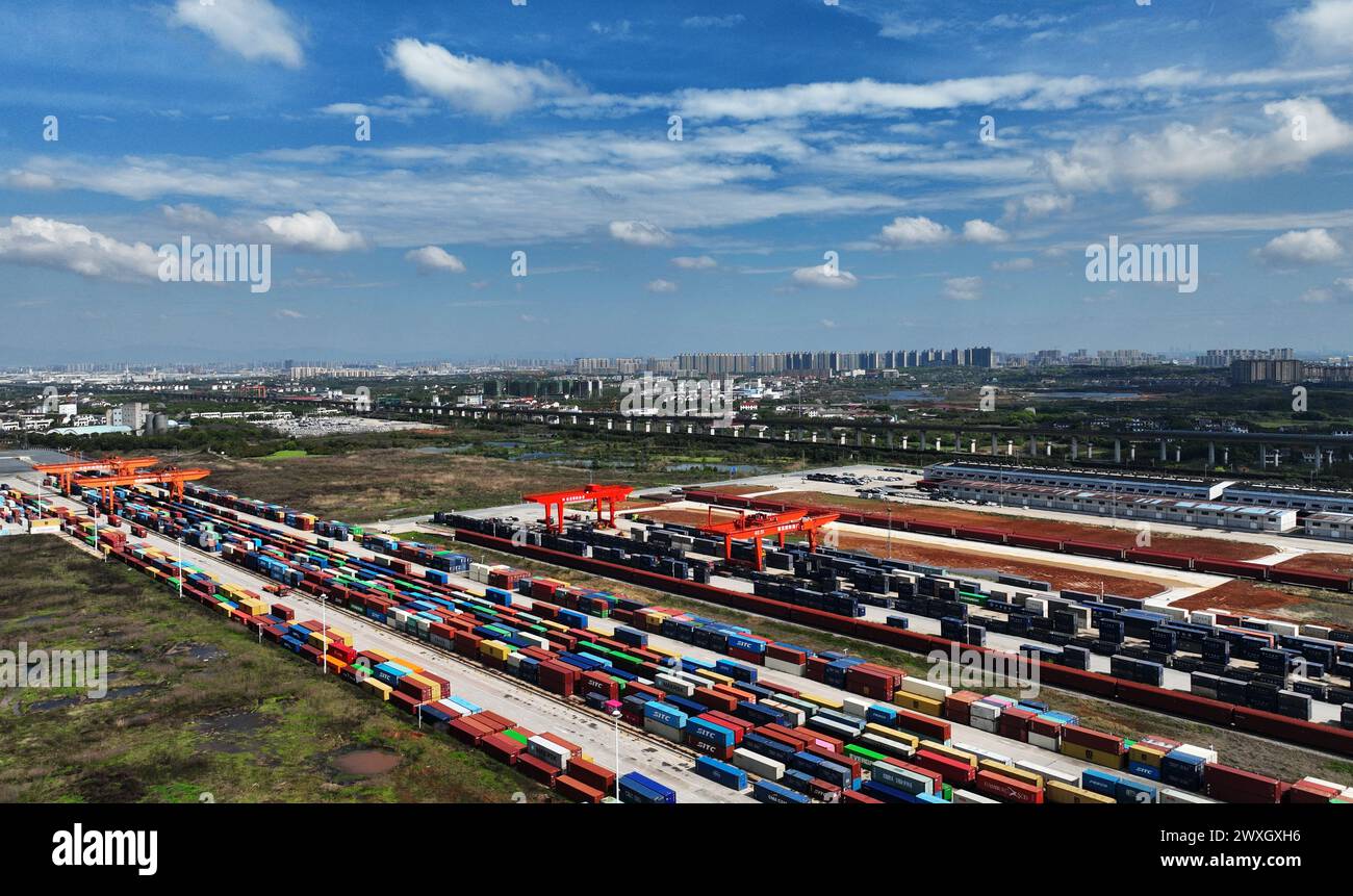 NANCHANG, CHINA - MARCH 31, 2024 - A gantry crane is lifting containers ...