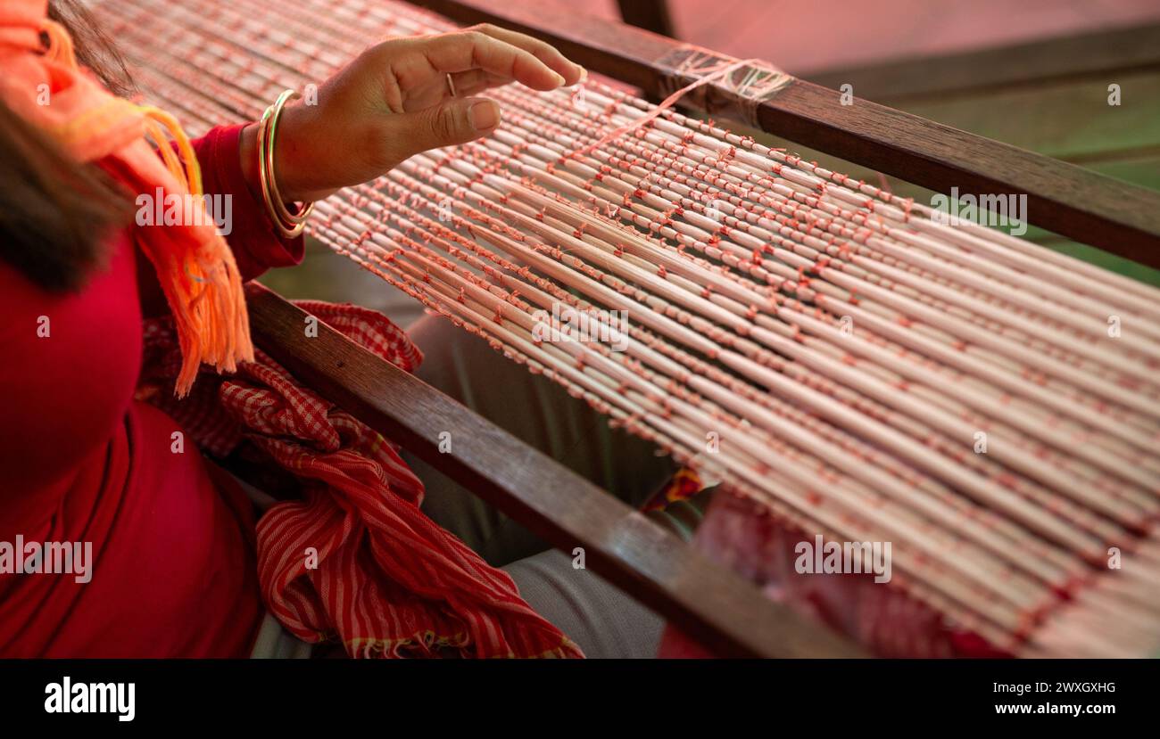 Cambodian Local Woman Weaving on a loom Stock Photo - Alamy