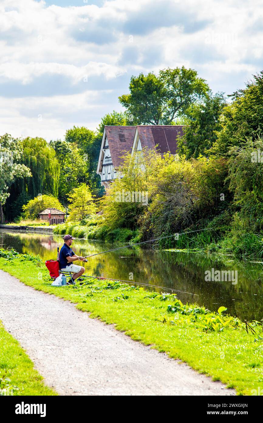 Man fishing in the River Lee Navigation Canal and the The Navigation ...