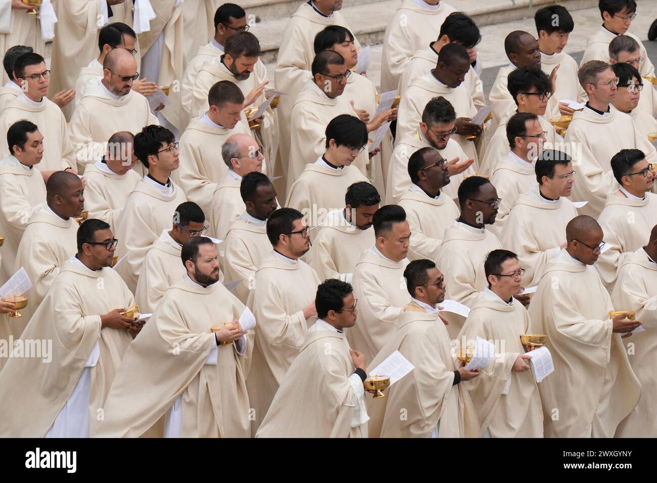 Priests stand during Easter mass in St. Peter's Square celebrated by ...