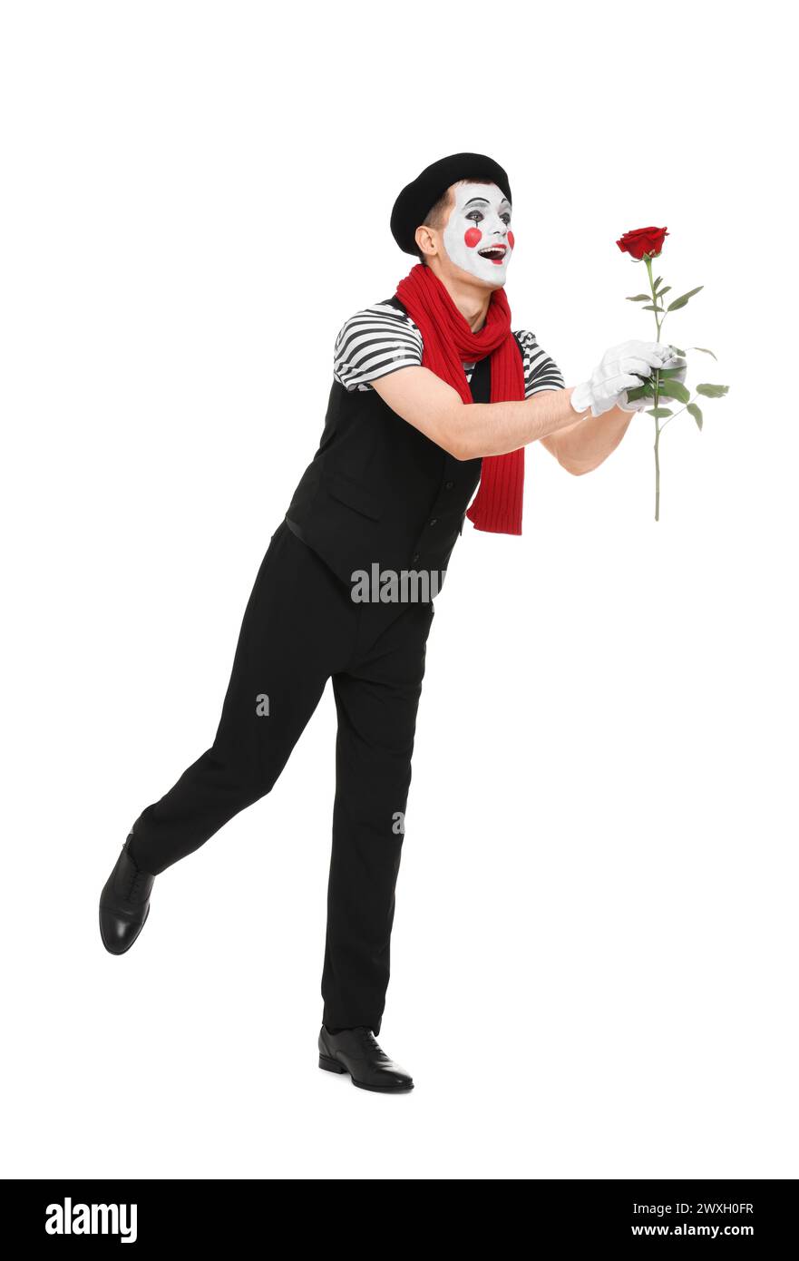 Funny mime artist with red rose posing on white background Stock Photo ...