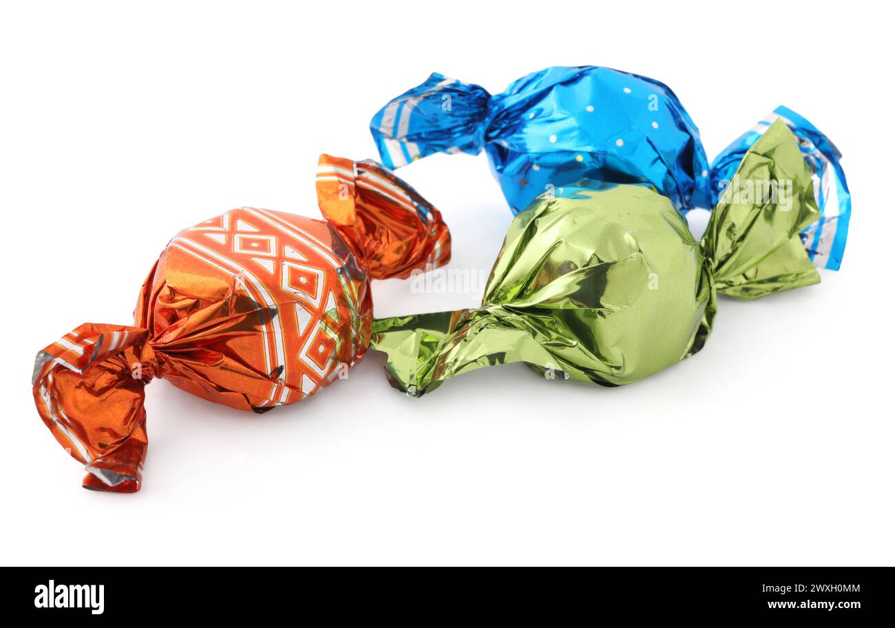 Sweet candies in colorful wrappers on white background Stock Photo - Alamy