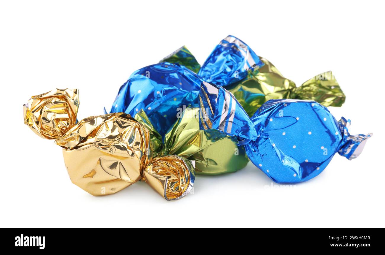 Candies in colorful wrappers isolated on white Stock Photo - Alamy