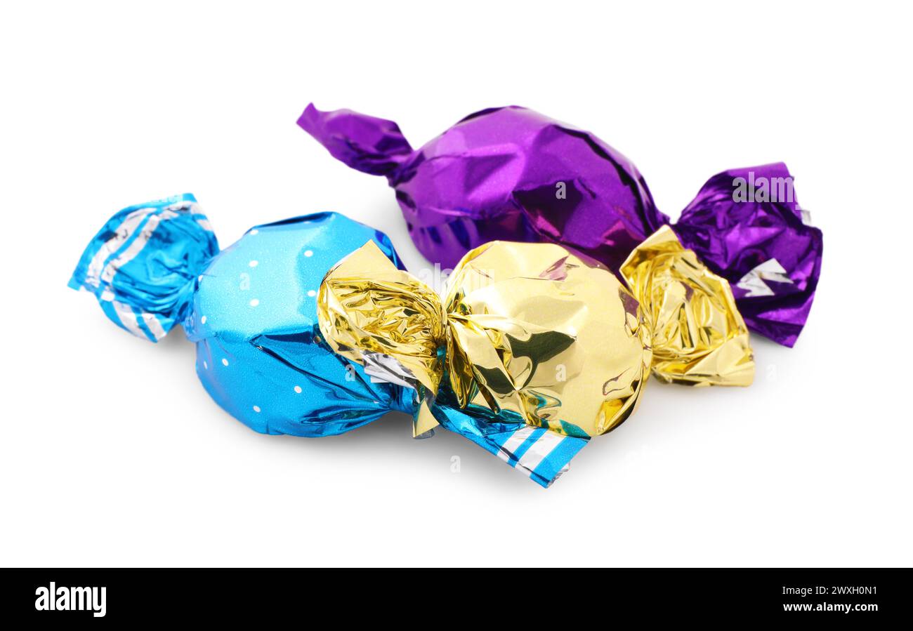 Sweet candies in colorful wrappers on white background Stock Photo - Alamy