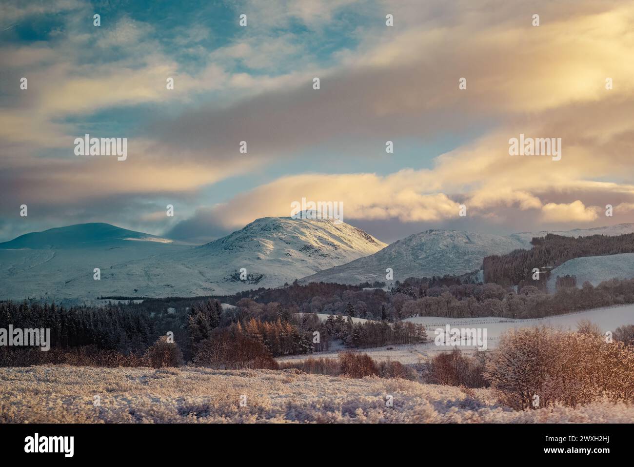Snow-capped mountains at sunset, including Stob Coire Sgriodain, in the ...
