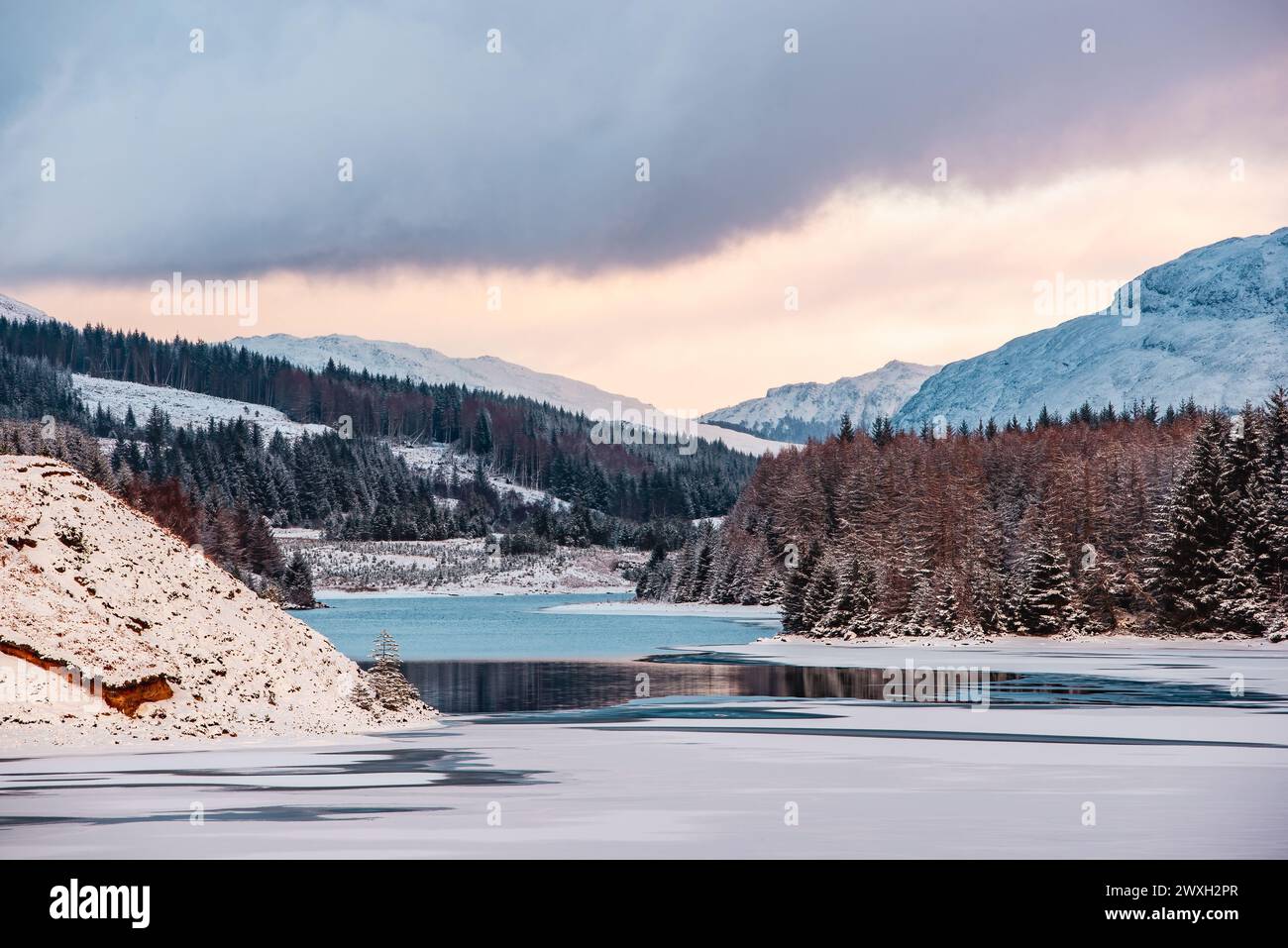 Frozen Laggan Dam in the Scottish Highlands at sunset Stock Photo - Alamy