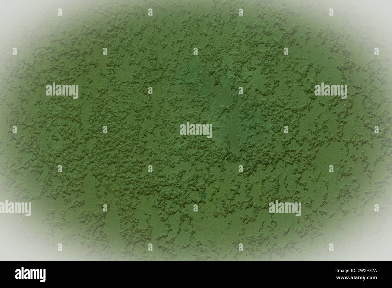 White vignette on green plaster rough wall background texture stucco ...