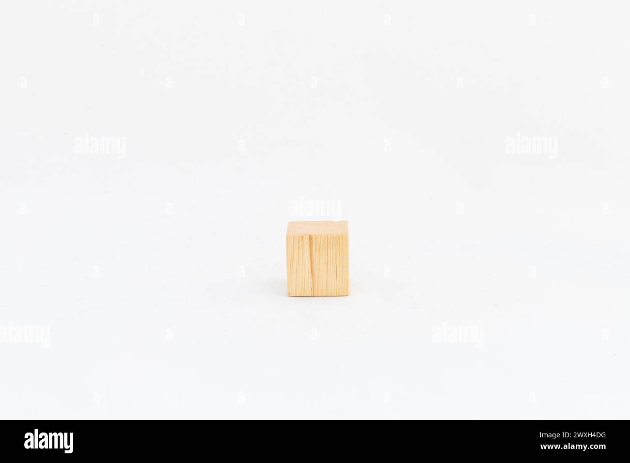 Single wooden cube isolated on white background Stock Photo - Alamy