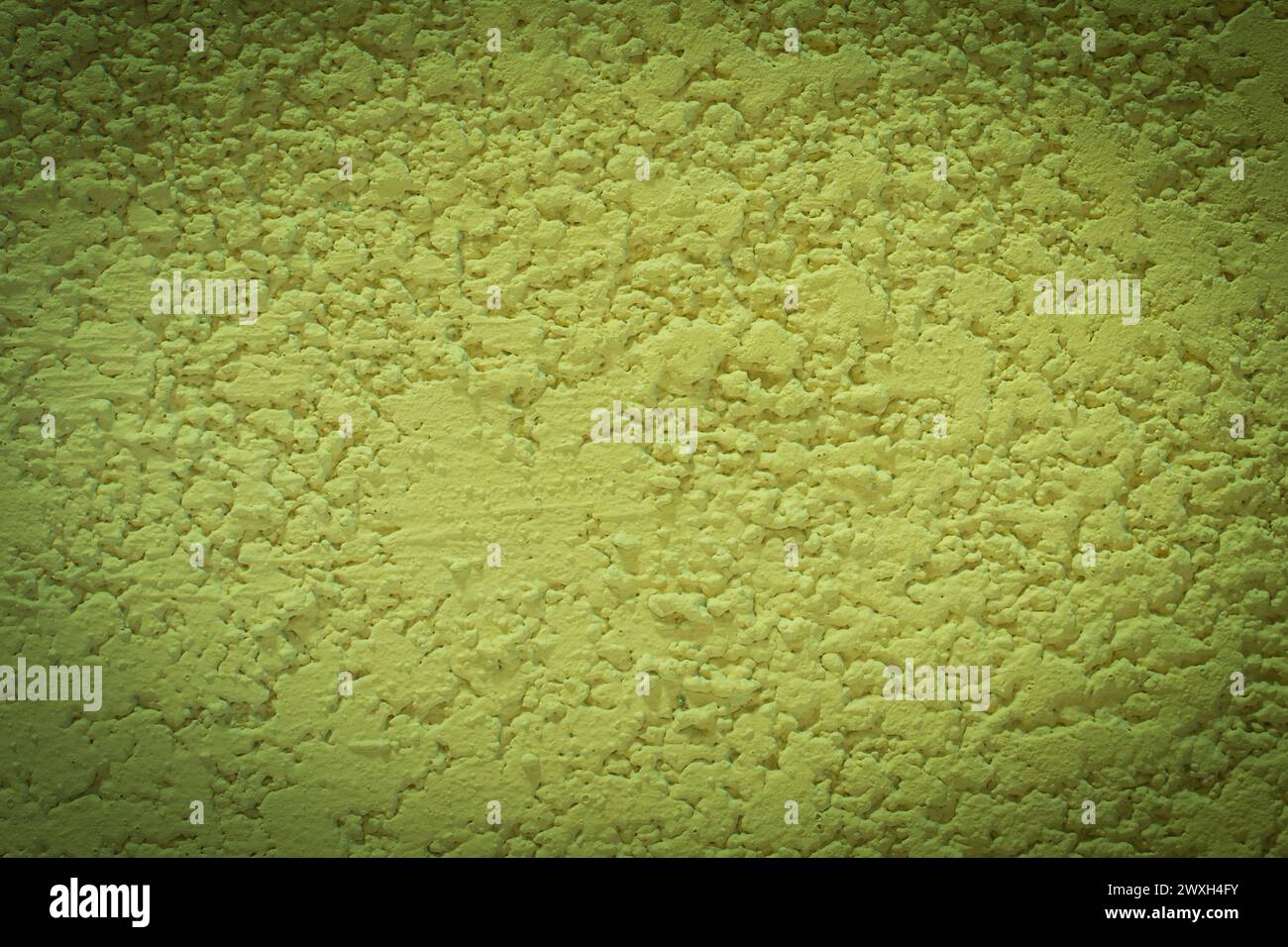 Light green paint on rough plaster wall solid background structure with ...
