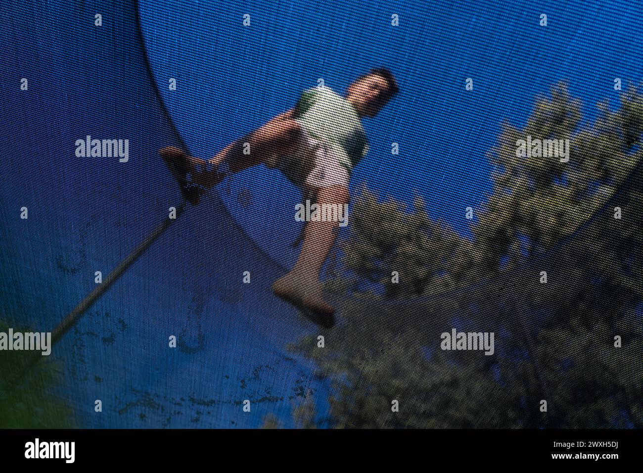 Child jumping on trampoline seen from below Stock Photo - Alamy