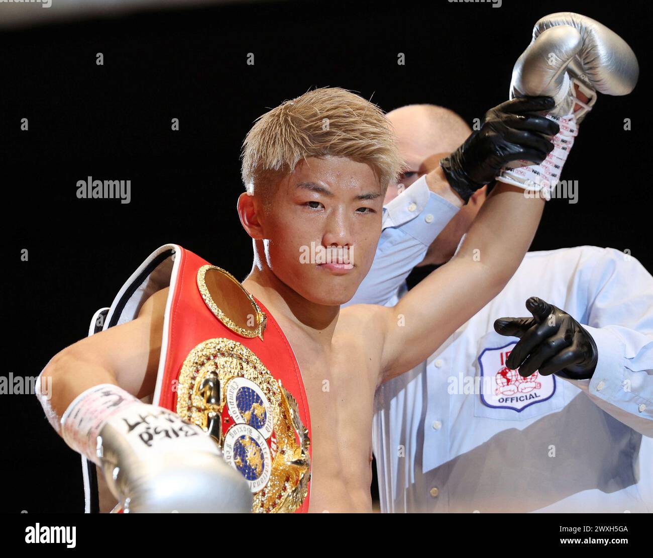 Japanese IBF minimumweight world champion Ginjiro Shigeoka shows a ...
