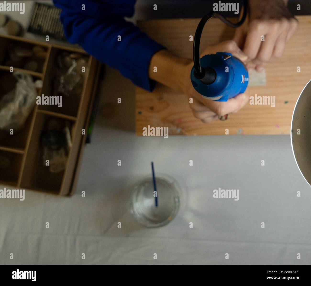 Woman carving a stone with tools in her workshop Stock Photo - Alamy